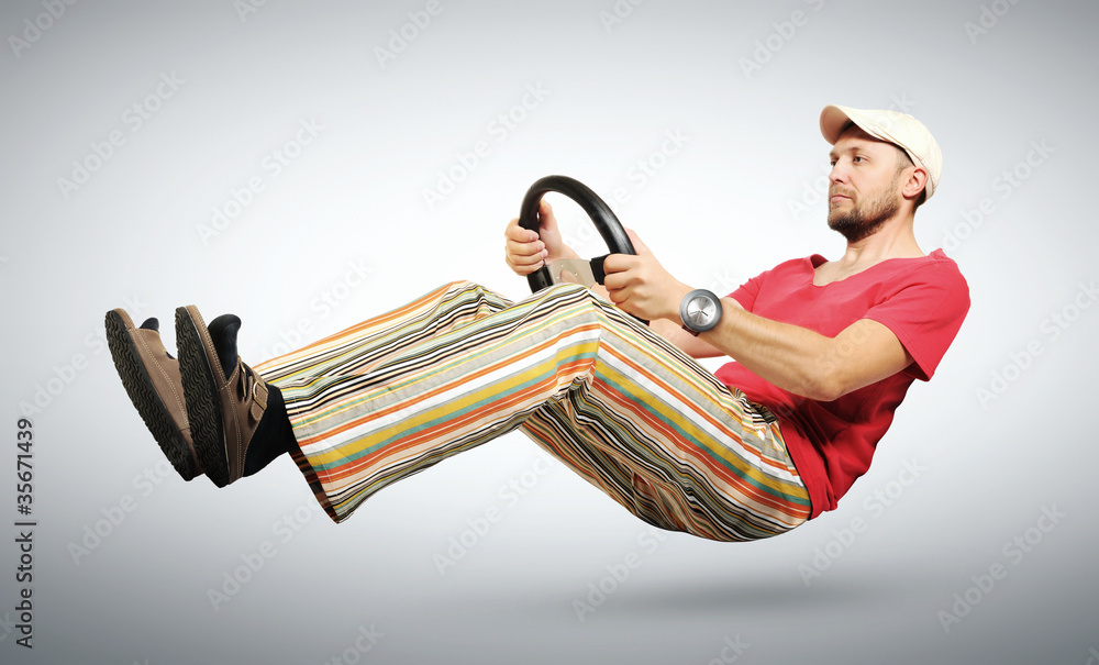 Unreal funny car driver in the humorous huge wristwatch Stock Photo ...