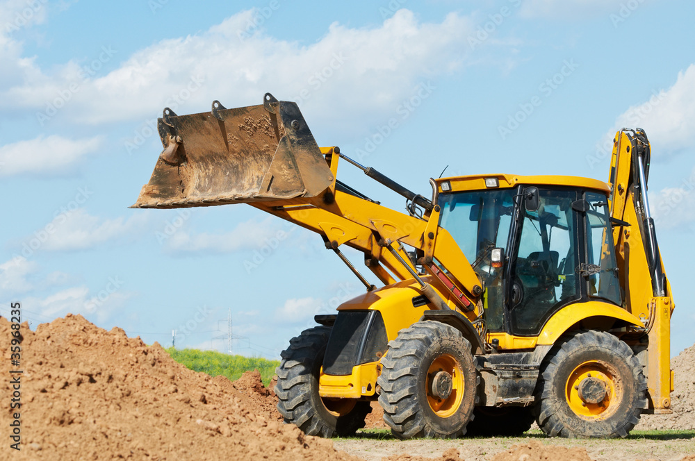 Excavator Loader with backhoe works Stock Photo | Adobe Stock