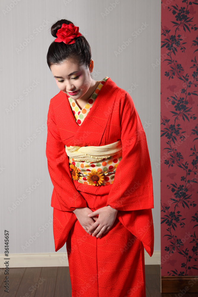 Bowing respect by Asian woman in Japanese kimono Stock Photo | Adobe Stock