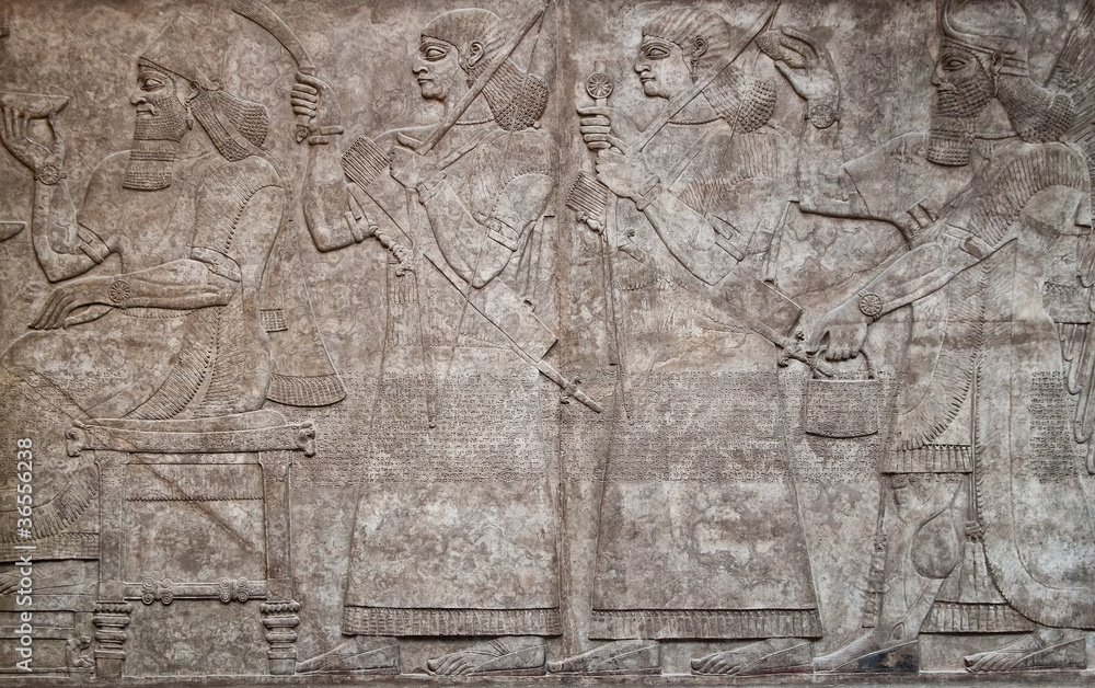 Assyrian clay relief depicting warriors and cuneiform writing Stock ...