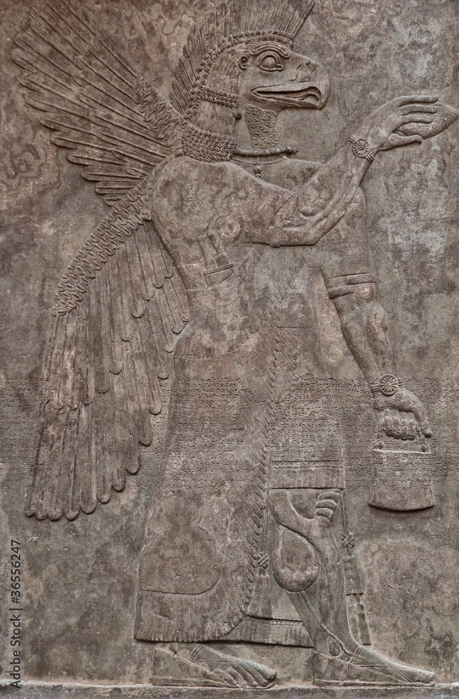 Assyrian clay relief depicting an eagle-faced god Stock Photo | Adobe Stock