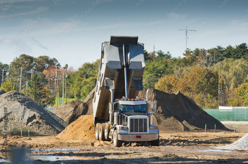 Dump Truck Dumping Dirt
