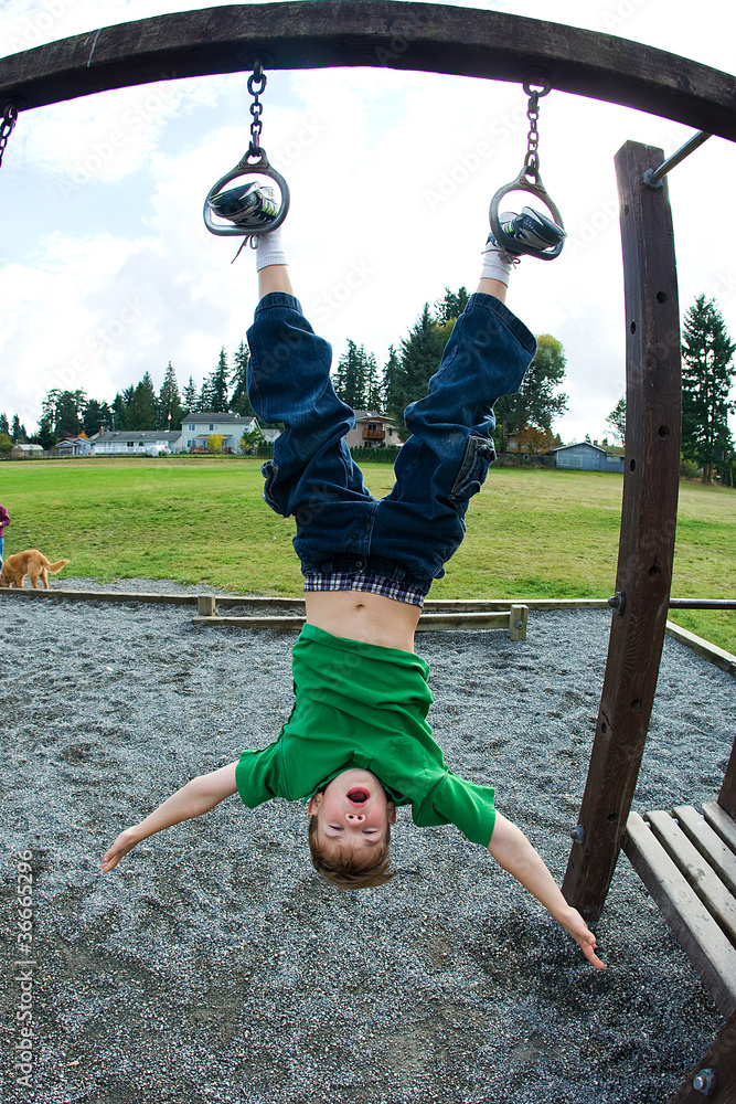 Child Hanging Upside Down Stock Photo | Adobe Stock