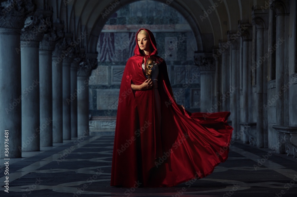 Beautifiul woman in red cloak outdoors Stock Photo | Adobe Stock