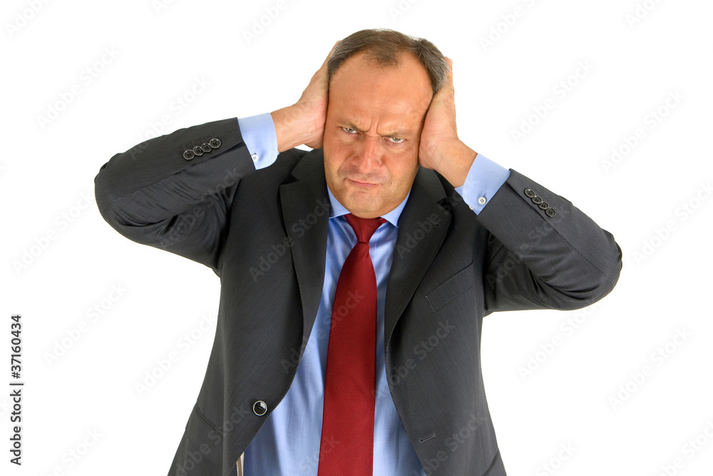 Mann hält sich die Ohren zu Stock-Foto | Adobe Stock