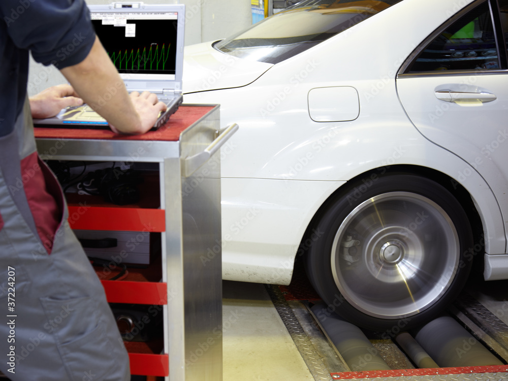 Car with test bench technology in a garage Stock-Foto | Adobe Stock