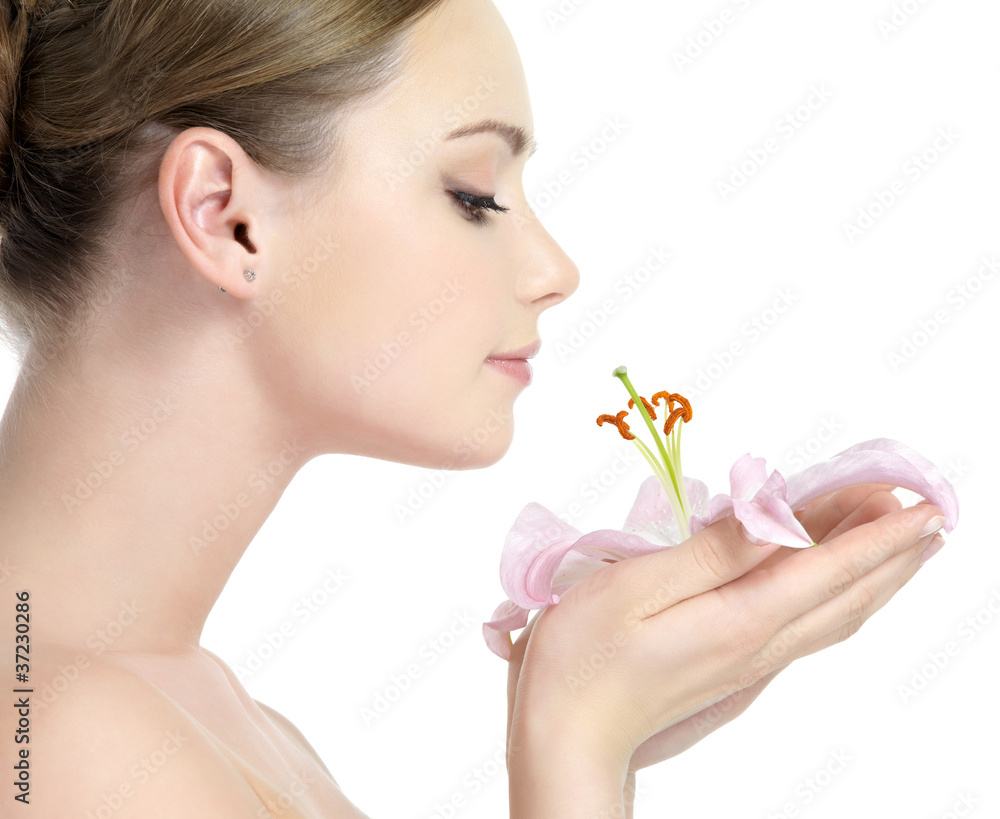 Profile face of beautiful girl smelling flower Stock Photo | Adobe Stock