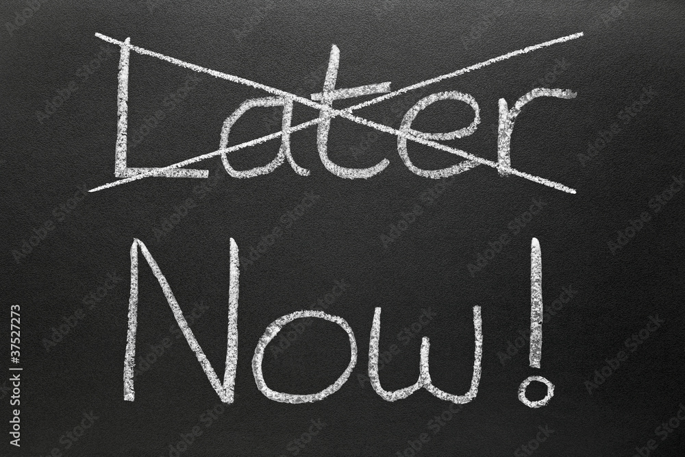 Crossing out later and writing now on a blackboard. Stock Photo | Adobe ...