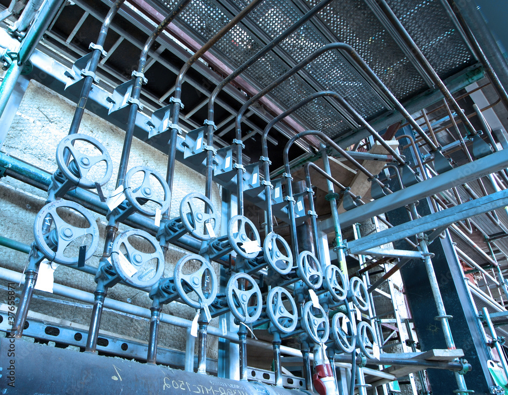 Pipes, tubes, machinery and steam turbine at a power plant Stock Photo ...