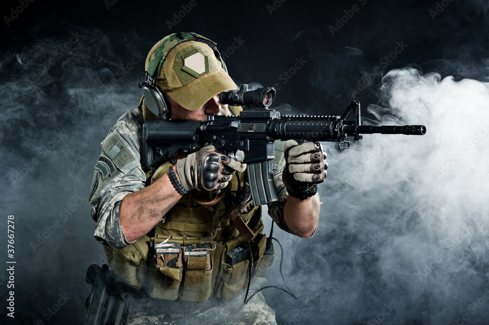 A soldier in the smoke after the explosion Stock Photo | Adobe Stock