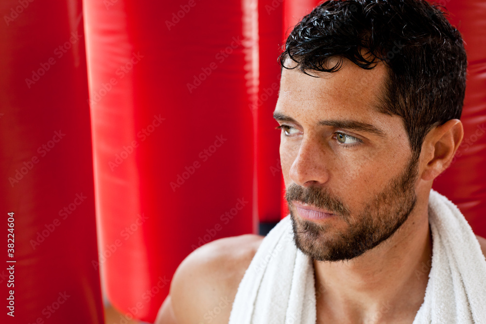 Handsome muscular man sweating with towel on his shoulders Stock Photo ...