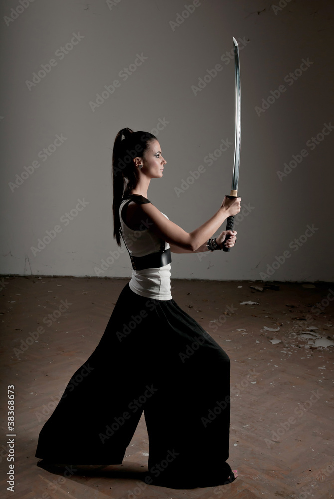 Woman Wielding Ceremonial Sword Stock Photo | Adobe Stock