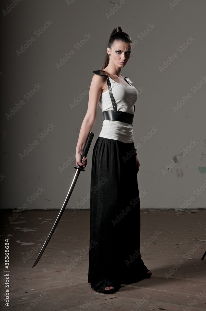 Woman Wielding Sword Stock Photo | Adobe Stock