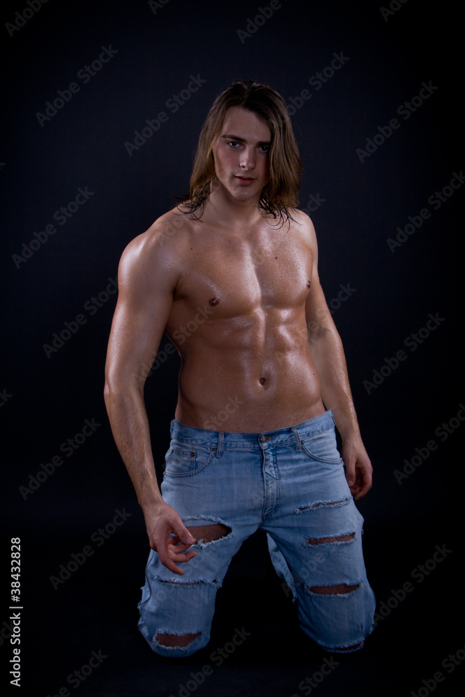 Muscular male body on black background Stock Photo | Adobe Stock