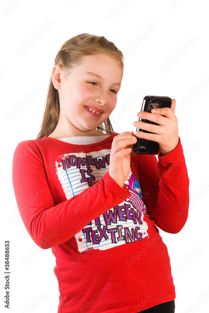 Young girl sending a text message Stock Photo | Adobe Stock