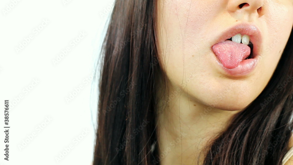 Girl licking her lips Stock Video | Adobe Stock