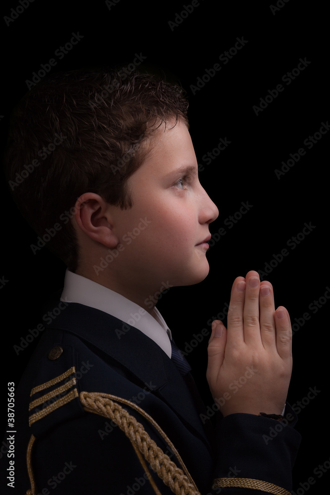 Handsome young boy praying. First holy comunnion portrait Stock Photo ...