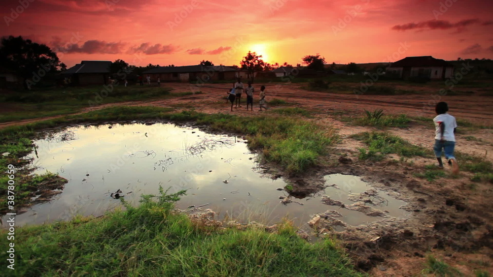 Kenya Africa, group of children playing near a village running past a ...