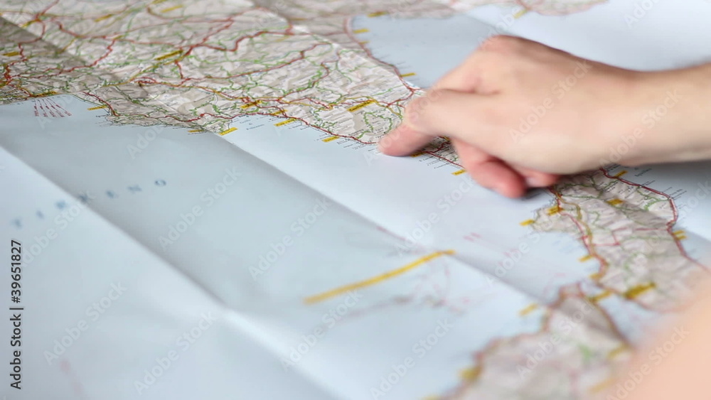 Looking at a route on a map Stock Video | Adobe Stock