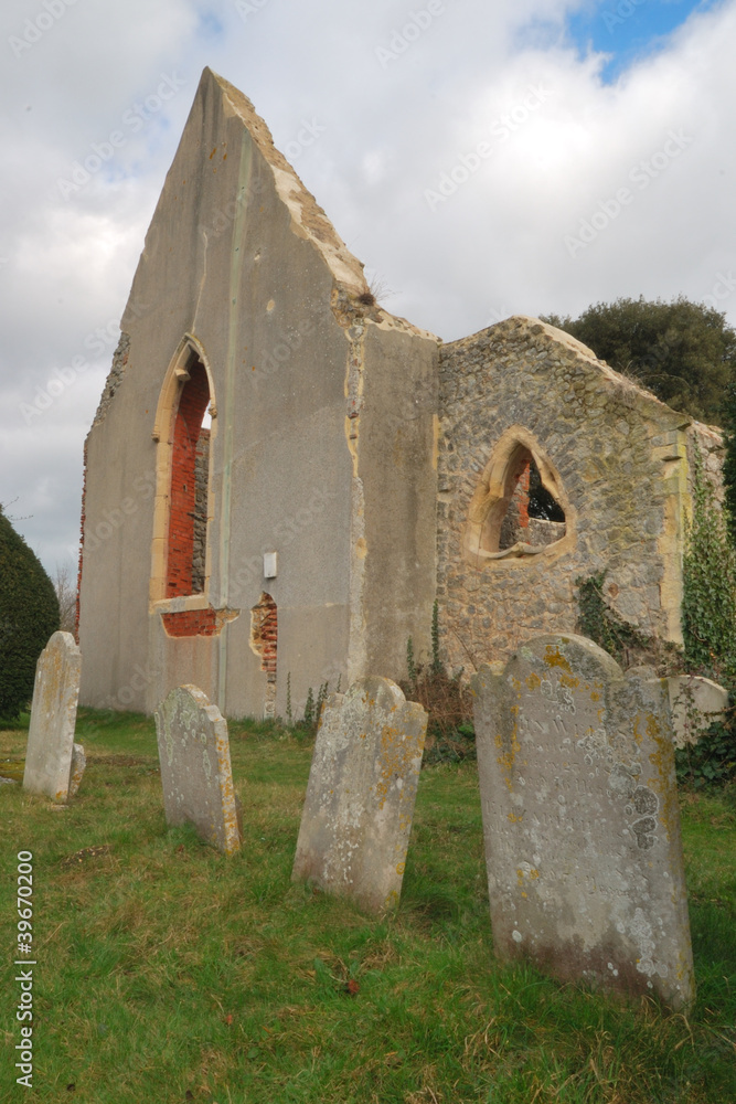 portrait view of ruined church with gravestones Stock Photo | Adobe Stock