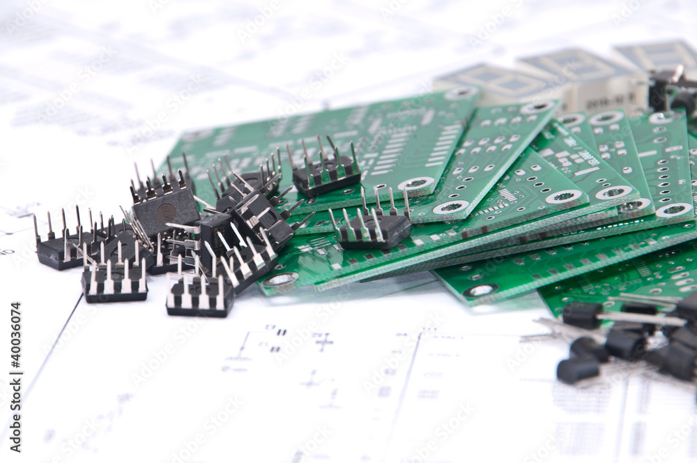 Circuit boards an components with schematics in background Stock Photo ...