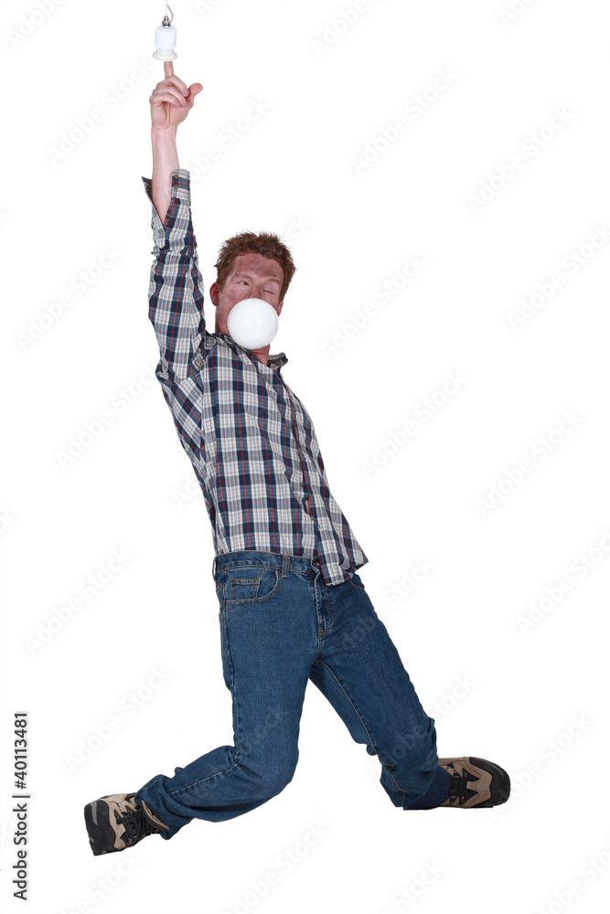 Man sticking his finger in the light socket Stock Photo | Adobe Stock