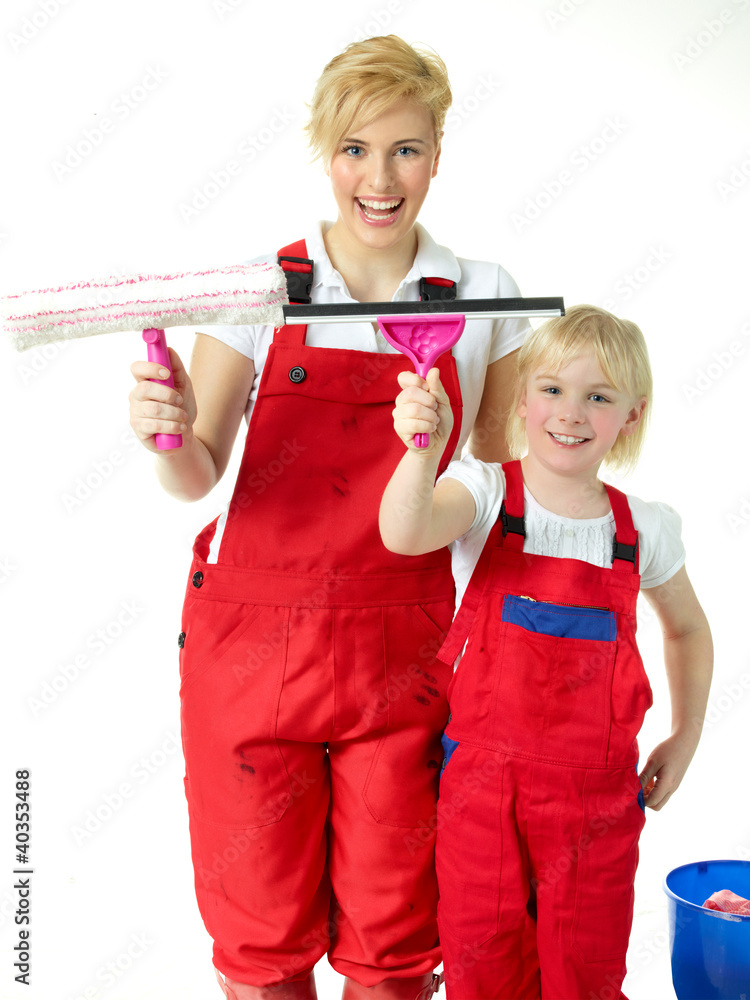 Sisters in overalls clean windows for spring cleaning Stock Photo ...