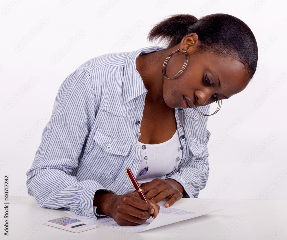South AFrican woman filling in a form. Stock Photo | Adobe Stock