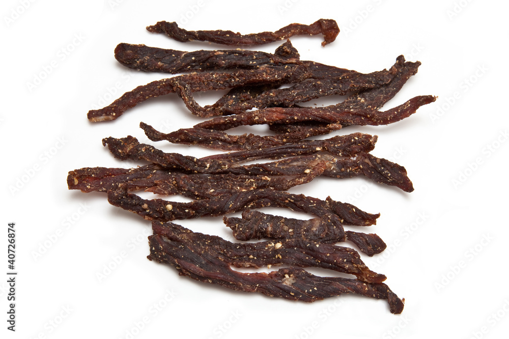 South African biltong strips isolated on a white background Stock Photo ...