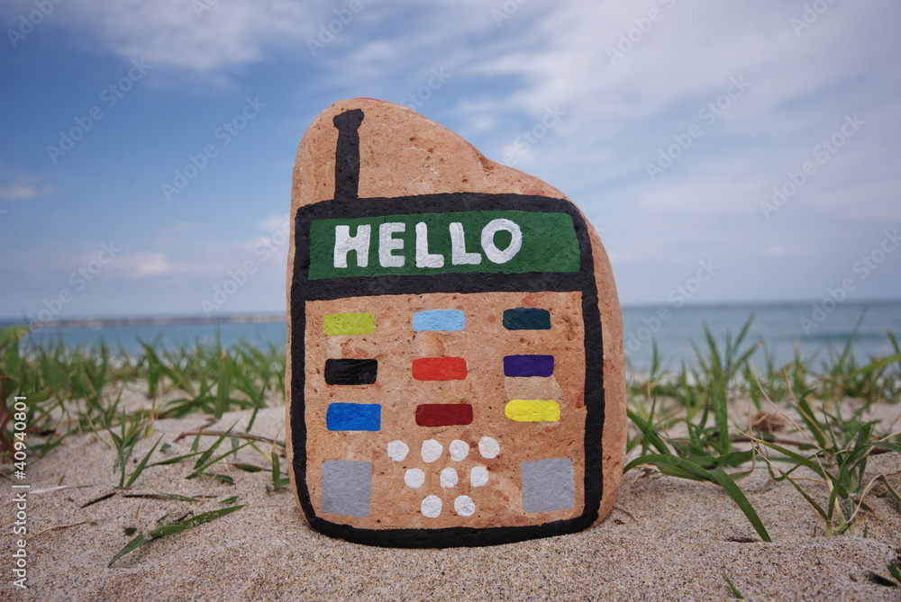 stone mobile phone on the sand Stock Photo | Adobe Stock