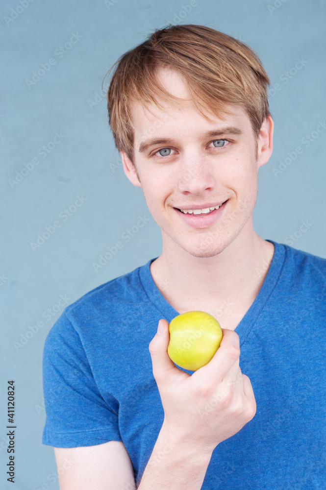 portrait of a young man with an apple Stock Photo | Adobe Stock