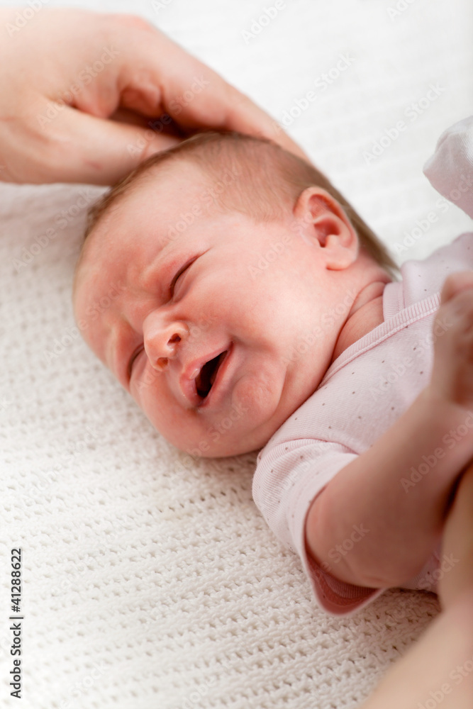 Newborn baby girl crying while her dad tries to comfort her Stock Photo ...