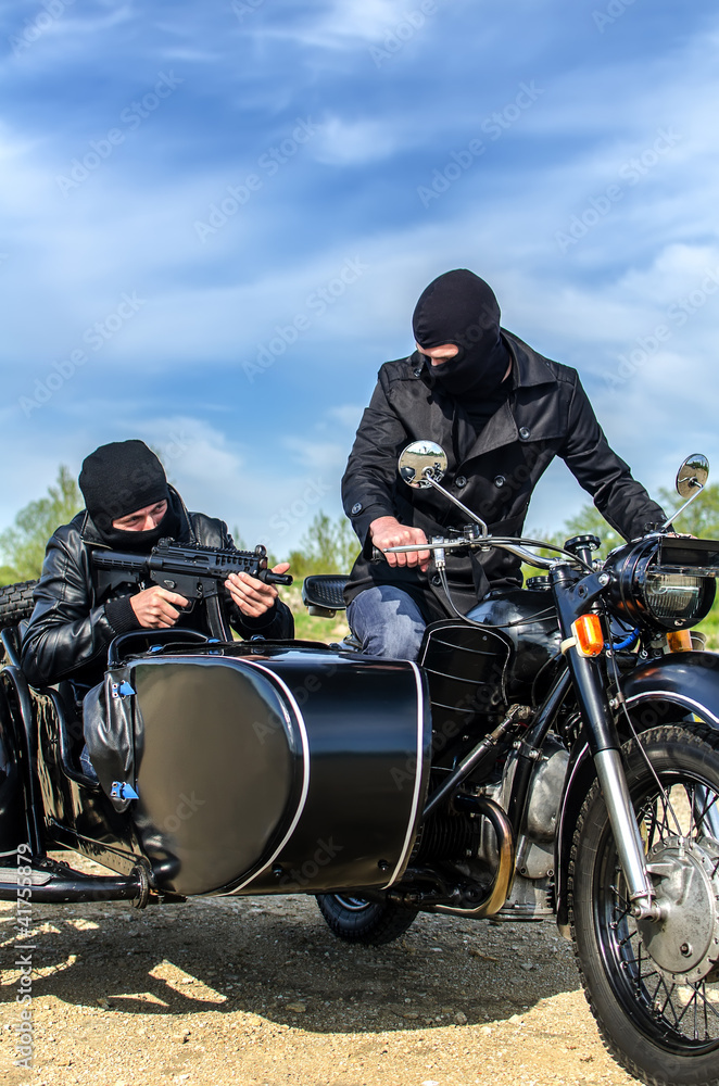 Two armed men riding a motorcycle with a sidecar Stock Photo | Adobe Stock