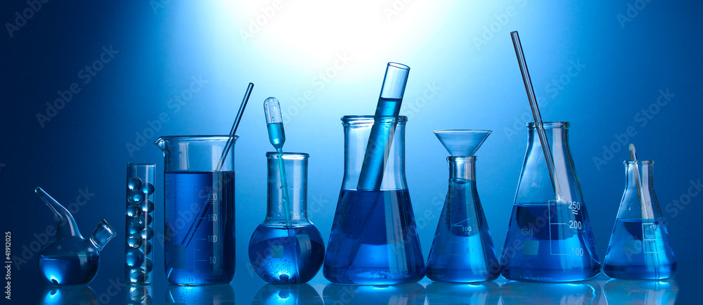 Test-tubes with blue liquid on blue background Stock Photo | Adobe Stock