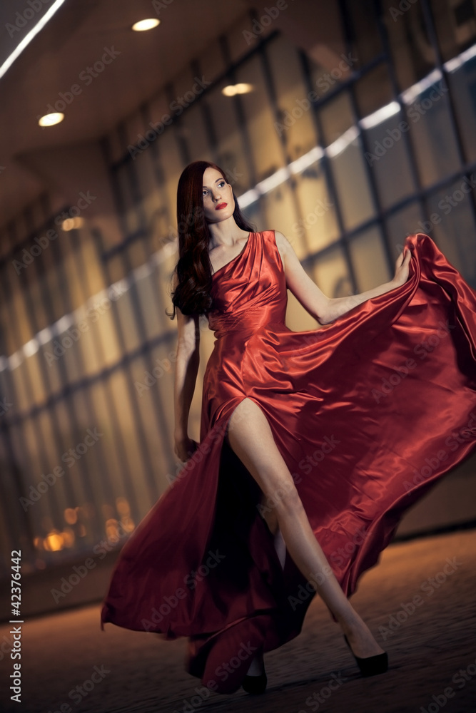 Sexy young beauty woman in fluttering red dress Stock Photo | Adobe Stock