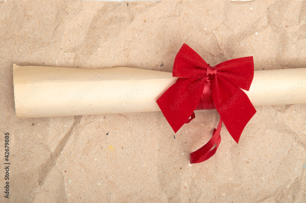 Diploma with red ribbon on old paper Stock Photo | Adobe Stock