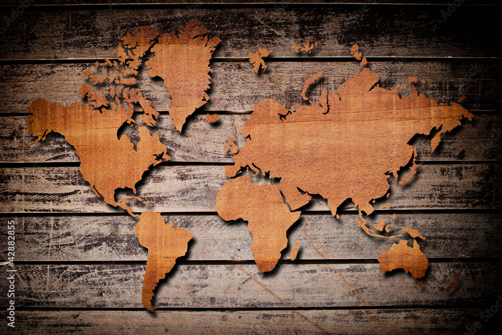 World map carving on wood plank. Stock Photo | Adobe Stock