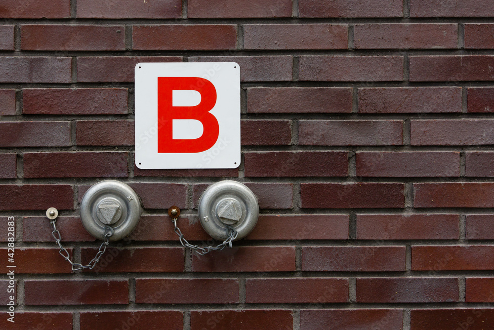Wall mounted fire hydrant for emergency use Stock Photo | Adobe Stock