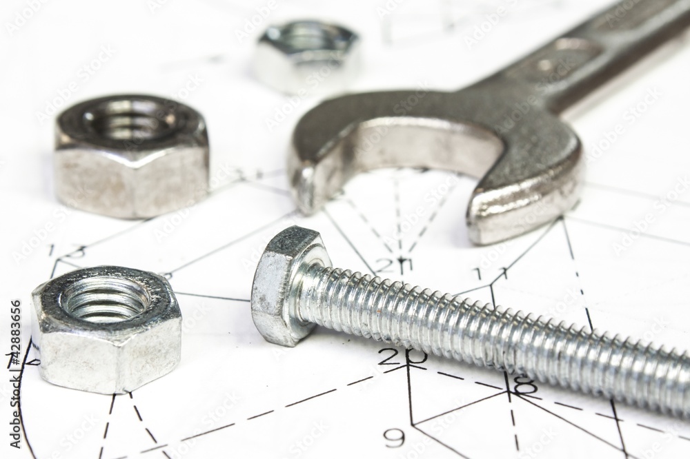 spanner and nuts on technical drawing Stock Photo | Adobe Stock