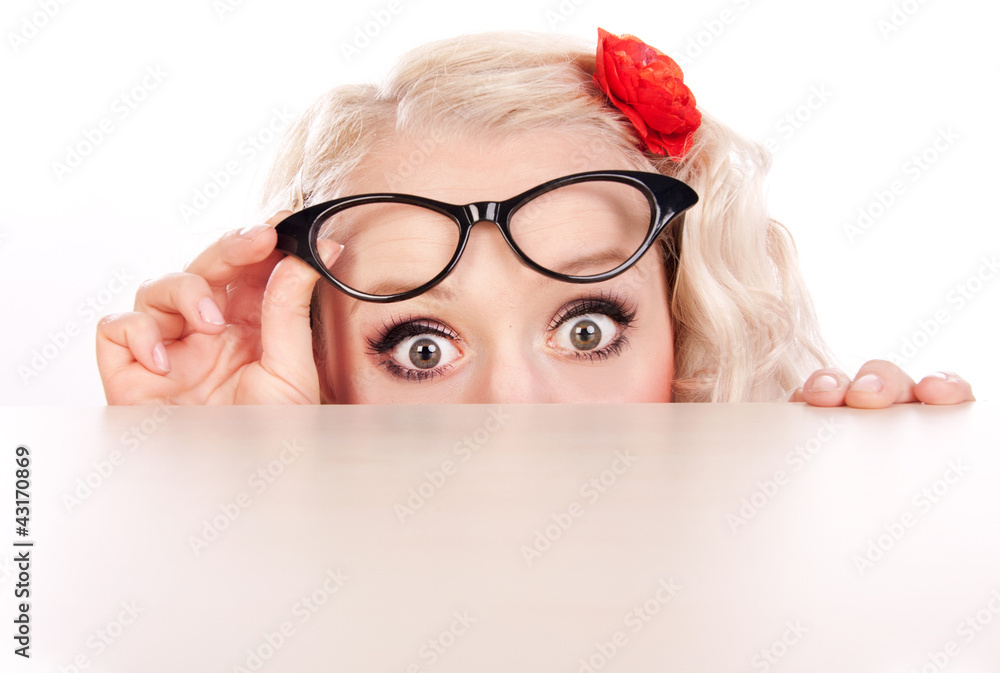 Funny girl hiding behind a table Stock-Foto | Adobe Stock