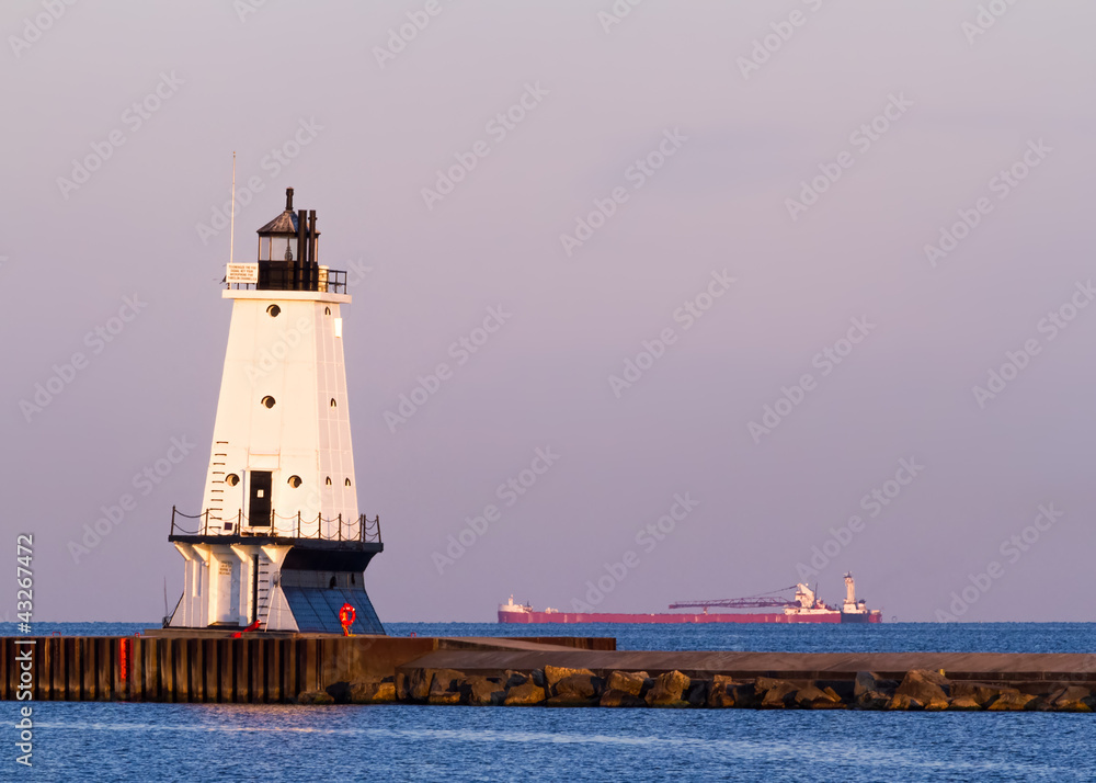 Poster A freighter passes a lighthouse – Wall Art | UkPosters