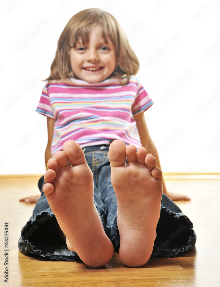 Little Girl Sitting On A Wooden Floor Stock Photo Adobe Stock