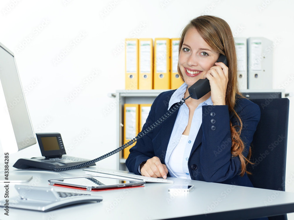 Secretary at work calling a customer for service Stock-Foto | Adobe Stock