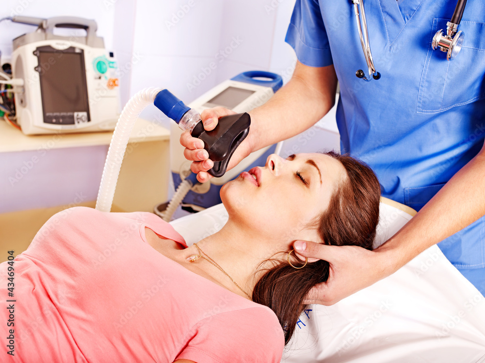 Patient wearing anesthesia mask at hospital. Stock Photo | Adobe Stock