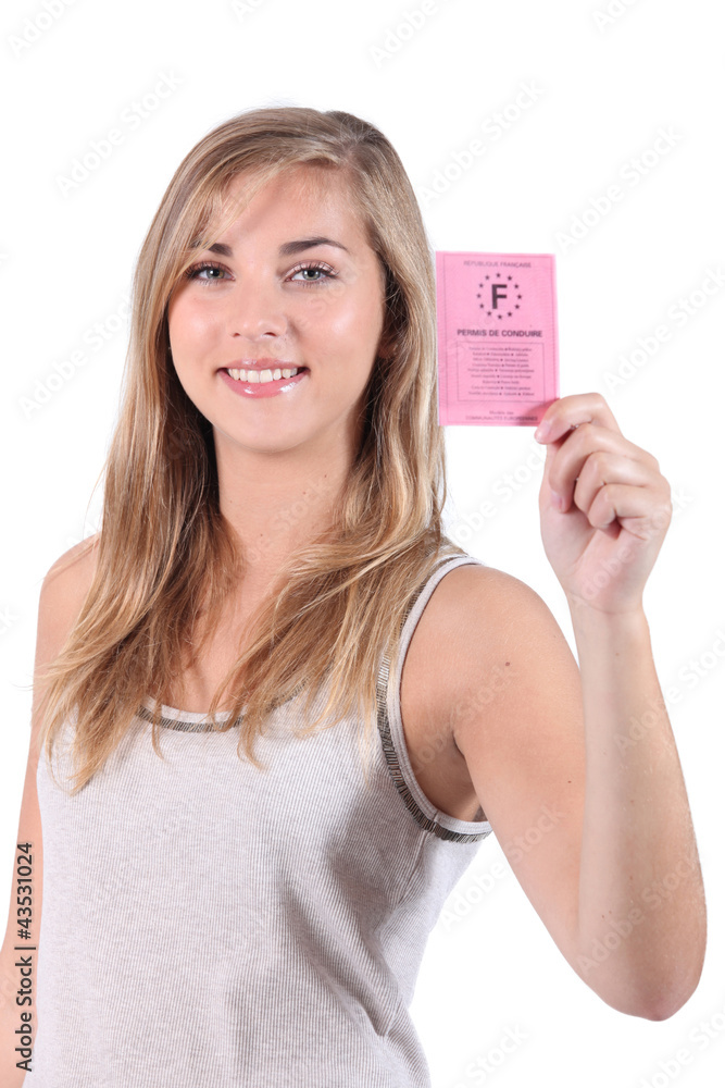 Girl showing driving licence Stock Photo | Adobe Stock