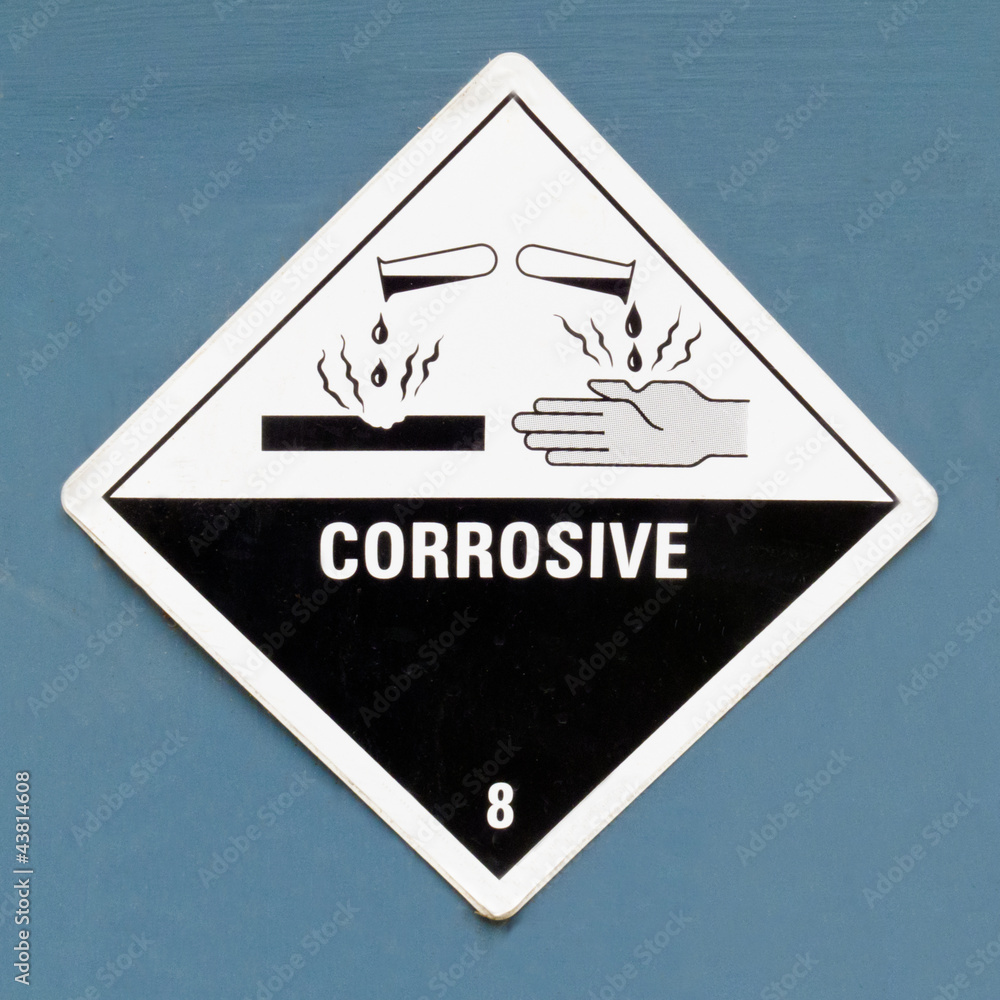 Corrosive hazard symbol warning sign on blue Stock Photo | Adobe Stock