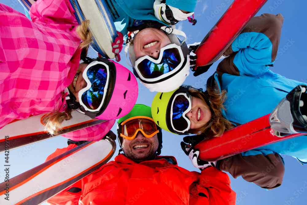 Skiing, winter fun - happy family ski team Stock Photo | Adobe Stock