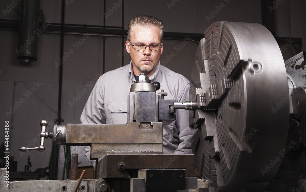Worker using Metal Lathe Stock Photo | Adobe Stock