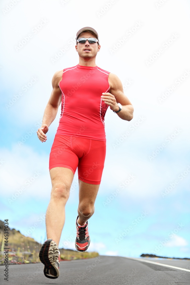 Triathlete running man Stock Photo | Adobe Stock