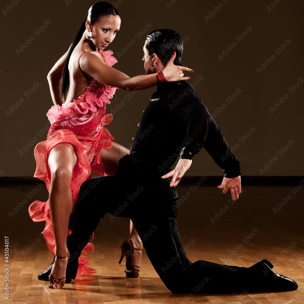 Foto Stock latino dance couple in action | Adobe Stock